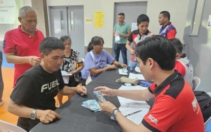 Owners of market stores affected by the fire in Iriga City receive P1.6 ...